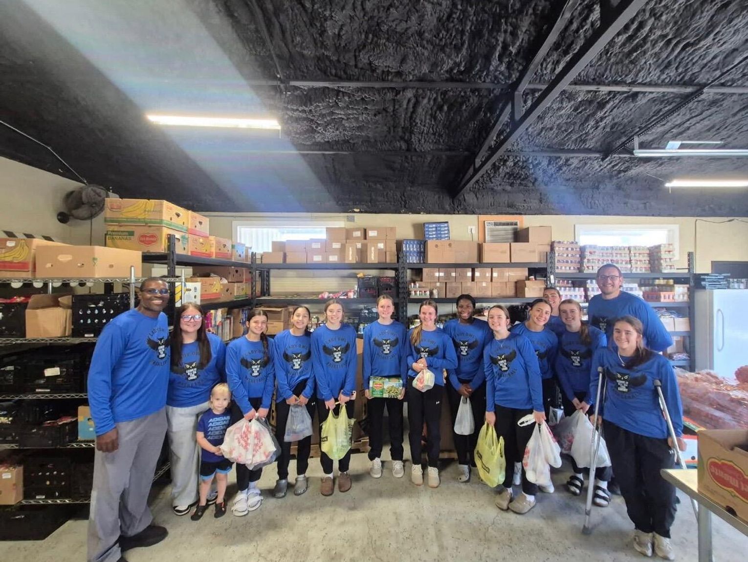 Lady Owls donate to Anderson Food Pantry